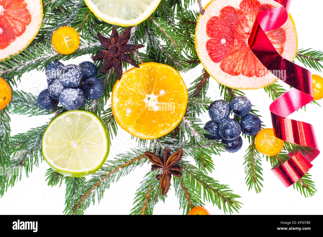 New Year and Christmas branch of spruce, decorated with fruits Stock ...