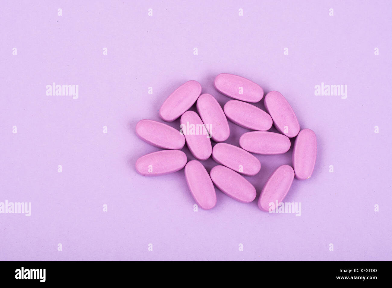 Colored medical capsules on bright background Stock Photo - Alamy