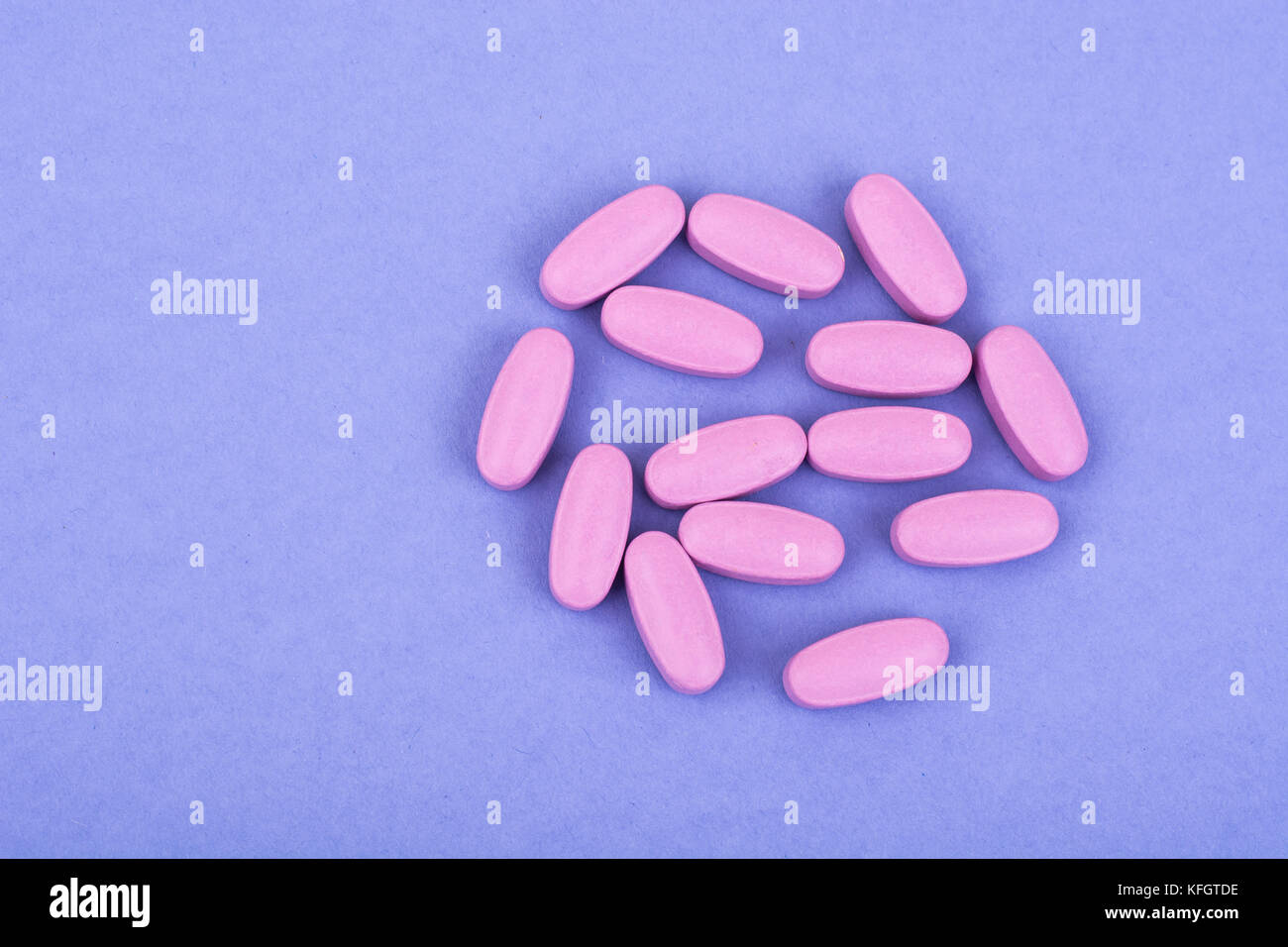 Colored medical capsules on bright background Stock Photo - Alamy