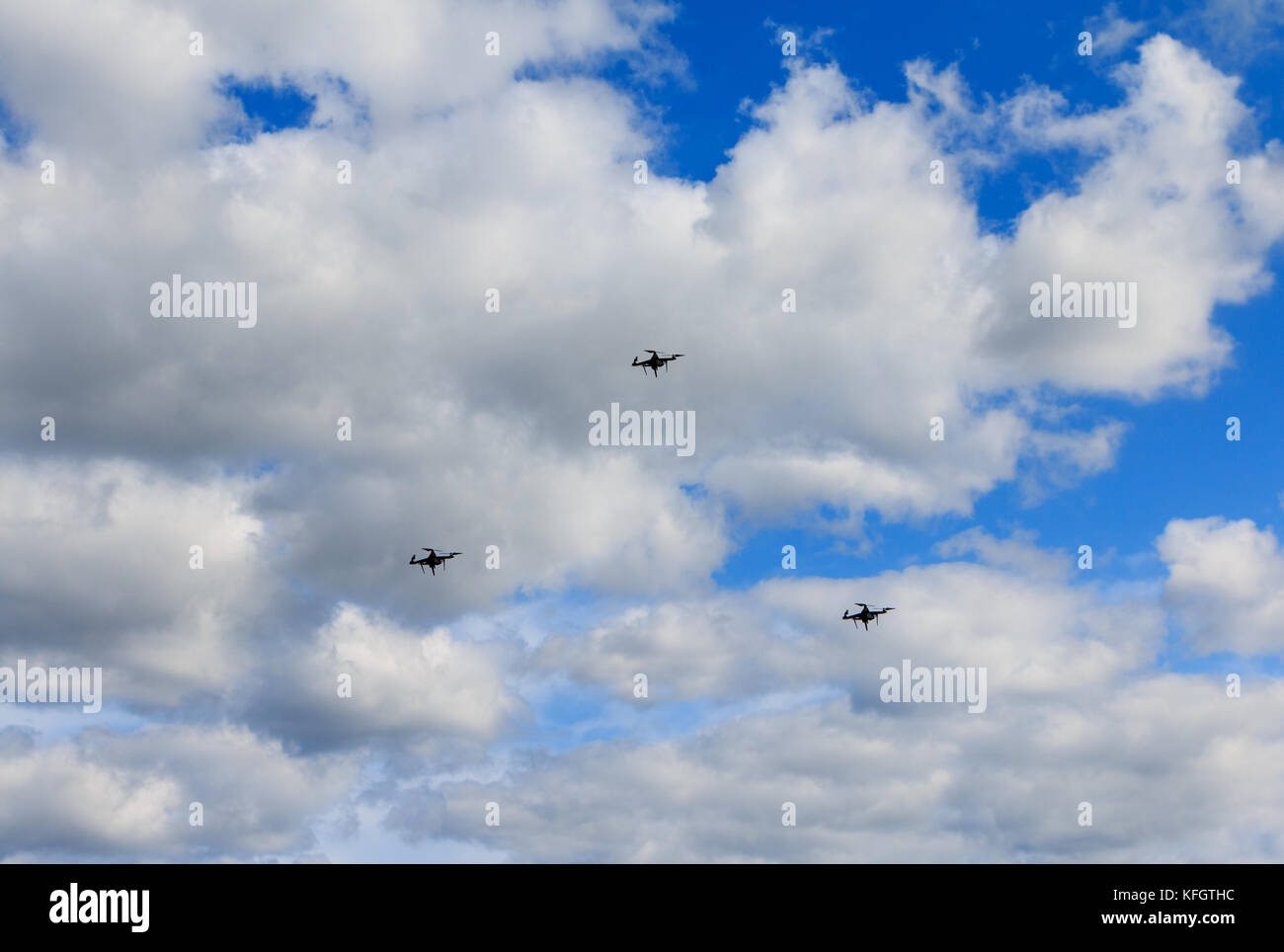 three drones in a blue sky Stock Photo - Alamy