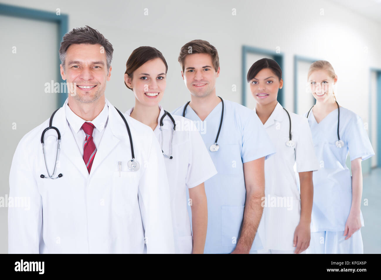 Portrait of confident medical team standing in row at hospital Stock ...