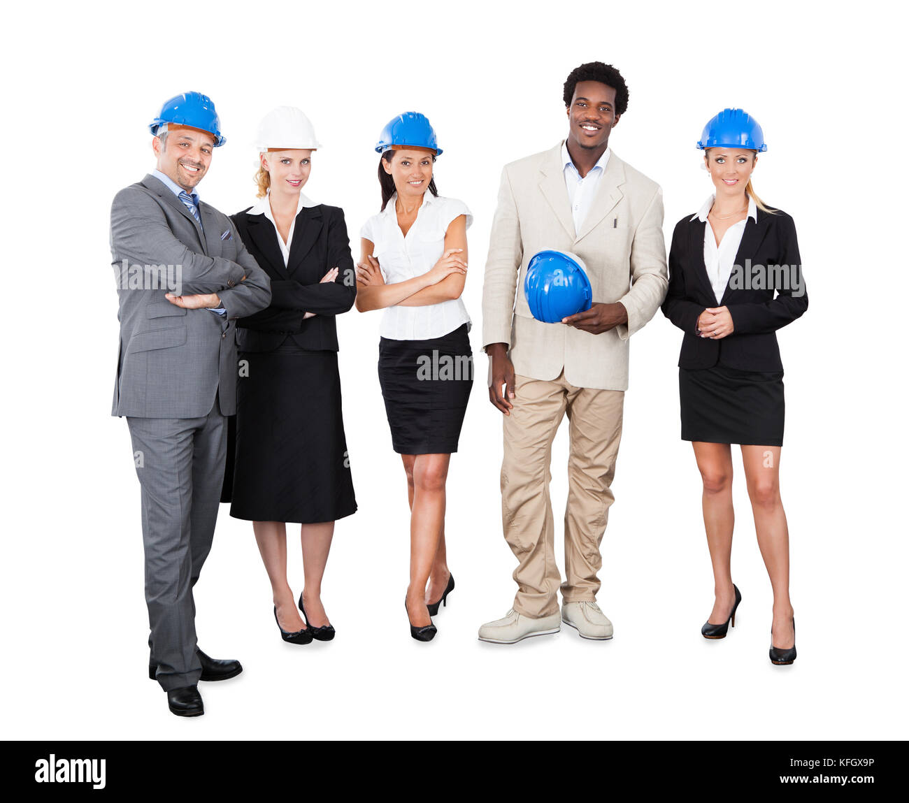 Full length portrait of multiethnic architects with hardhats standing ...