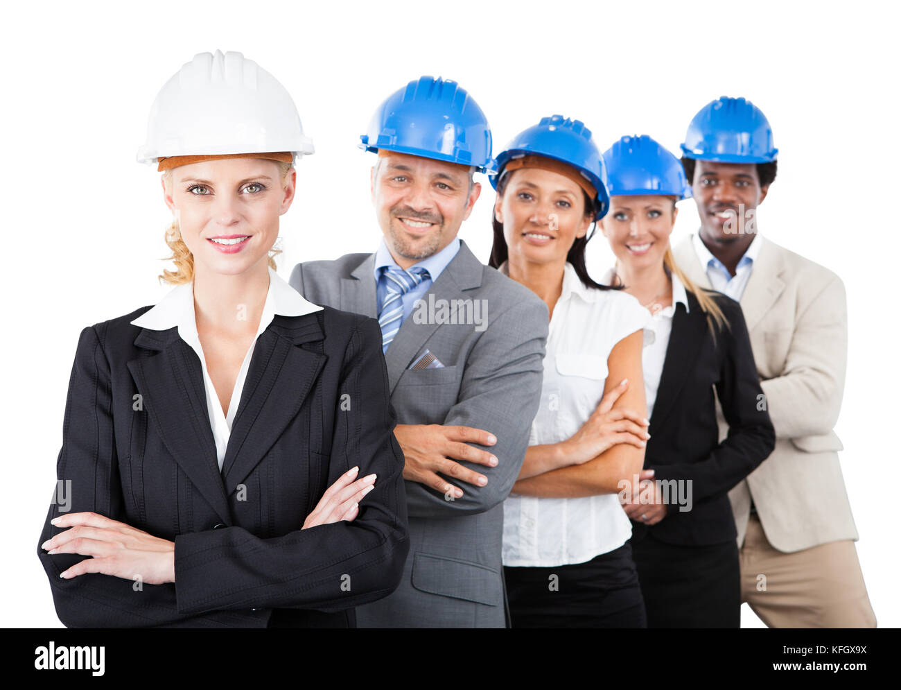Portrait of multiethnic architects wearing hardhats while standing arms ...