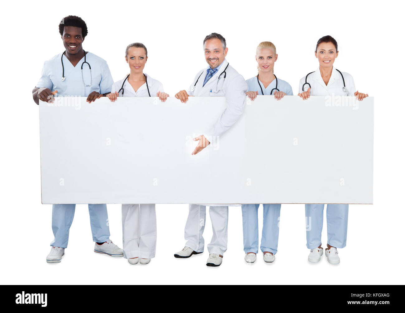 Full length portrait of happy doctor presenting blank billboard while ...