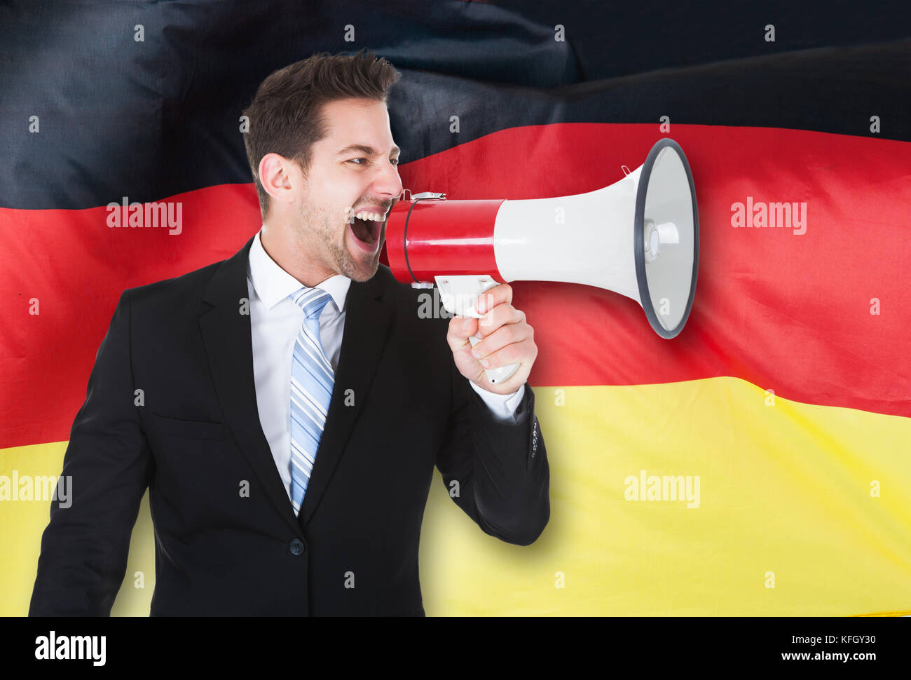 Portrait Of Young Businessman Shouting Through Megaphone In Front Of ...