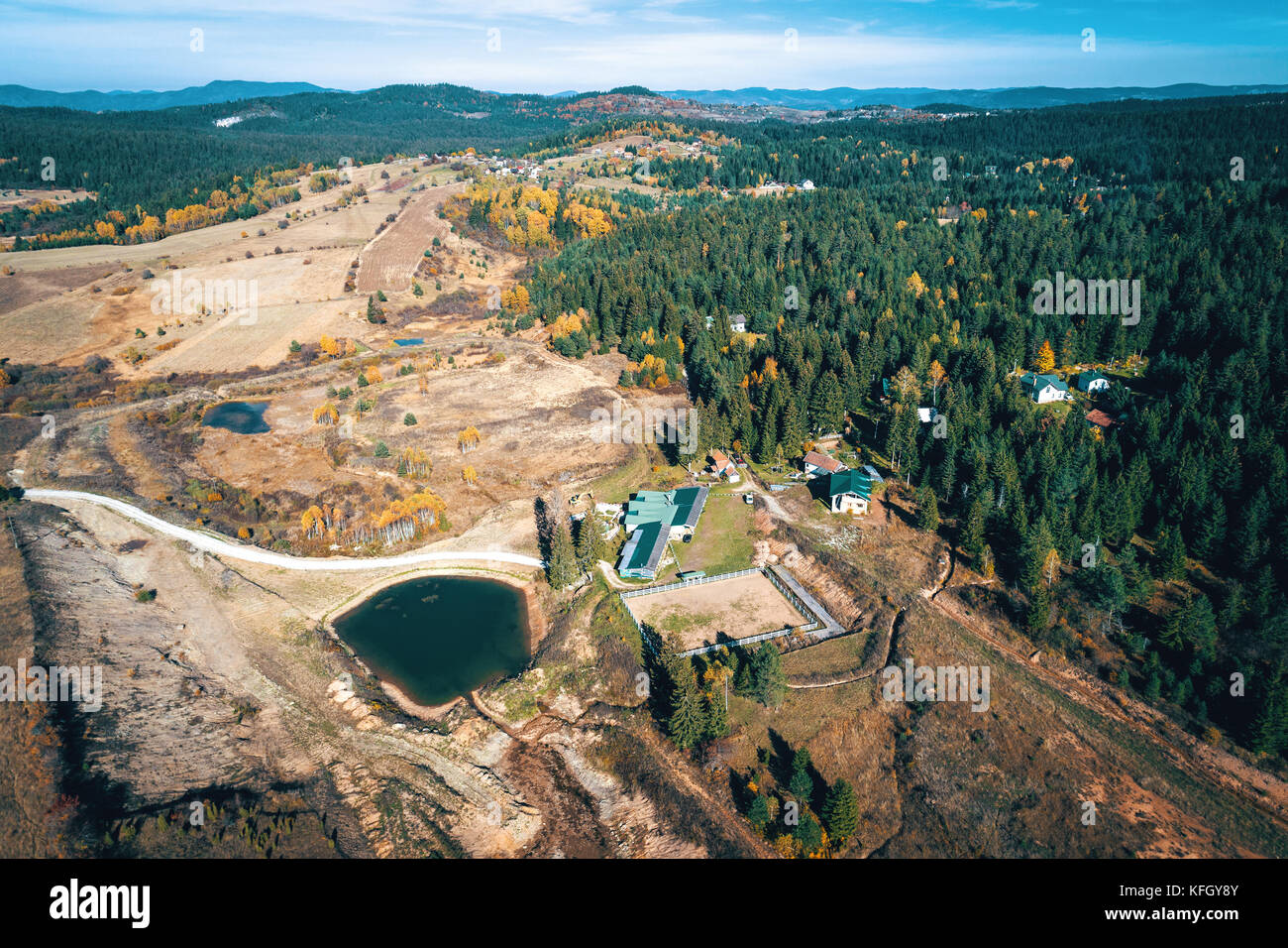 Aerial view of villa, pond and village on Nisici highlands in Bosnia ...