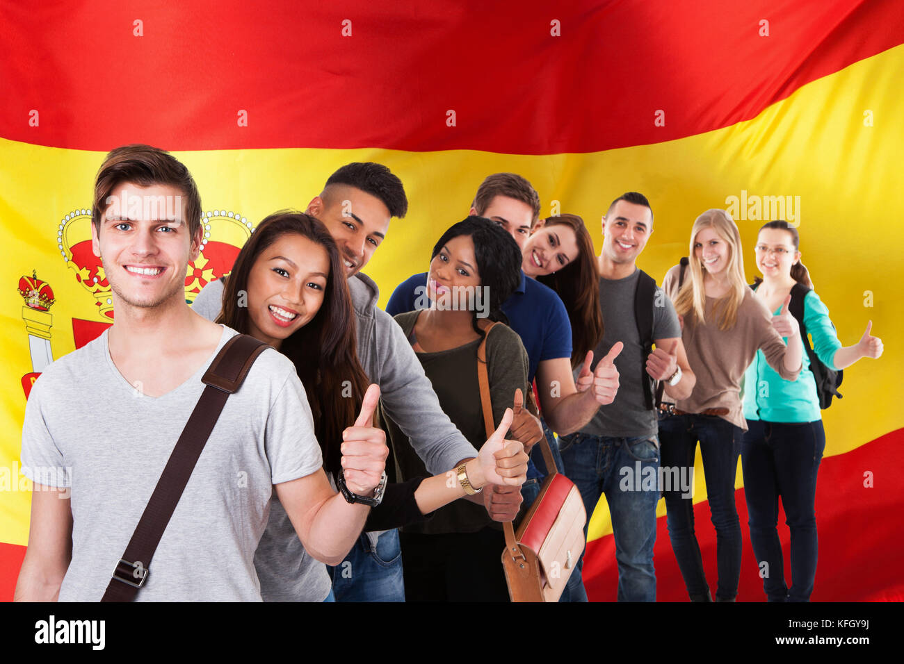Group Of Happy Multi Ethnic Students Standing In Front Of Spain Flag ...
