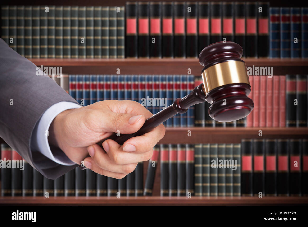 Male Judge Hand Striking The Wooden Gavel In A Courtroom Stock Photo ...