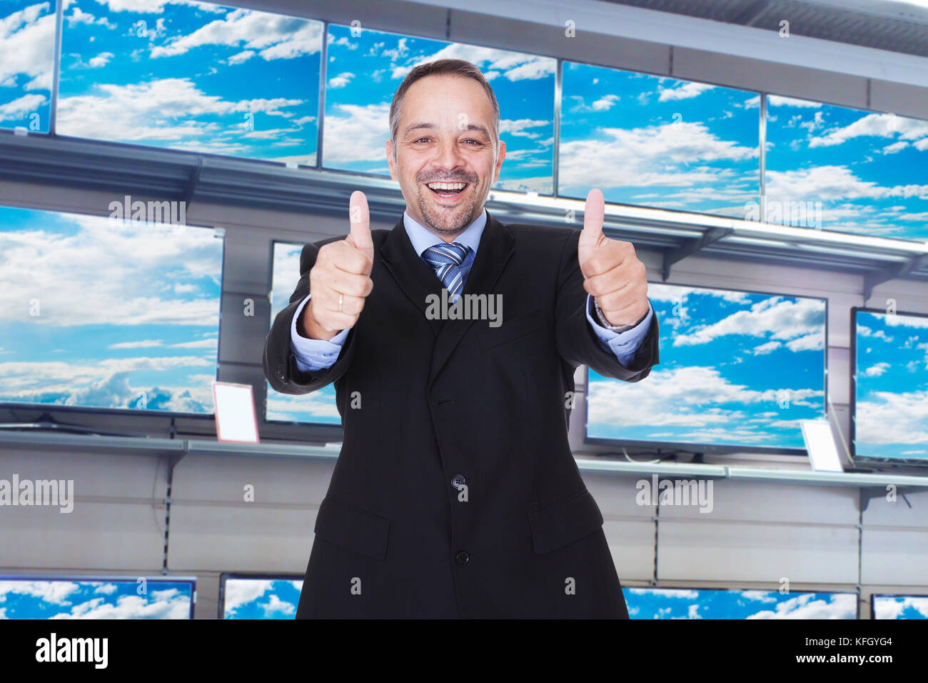 Portrait Of An Excited Storekeeper Gesturing Thumb Up Sign Stock Photo ...