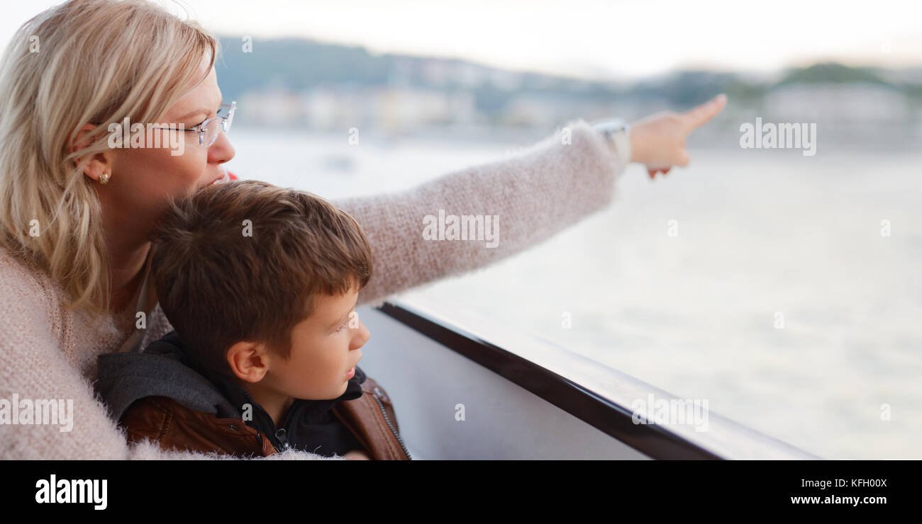Mother showing away to son, pointing to distance Stock Photo - Alamy
