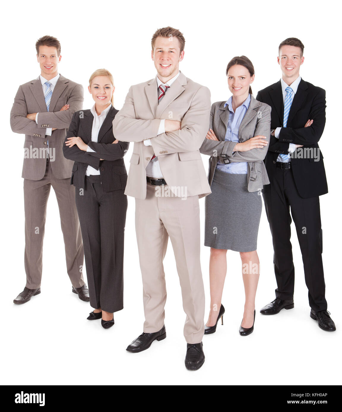 Full length portrait of confident business team standing arms crossed ...