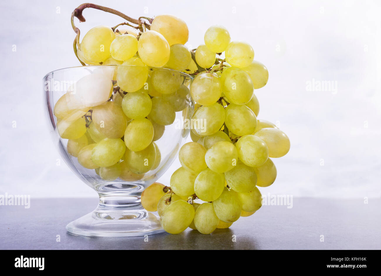Freshly cur sweet fruit grapes inside the glass Stock Photo - Alamy