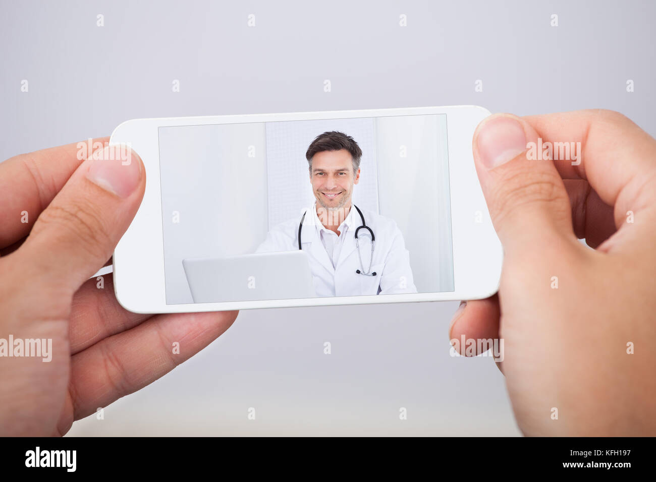 Doctor holding smartphone medical consultation hi-res stock photography ...