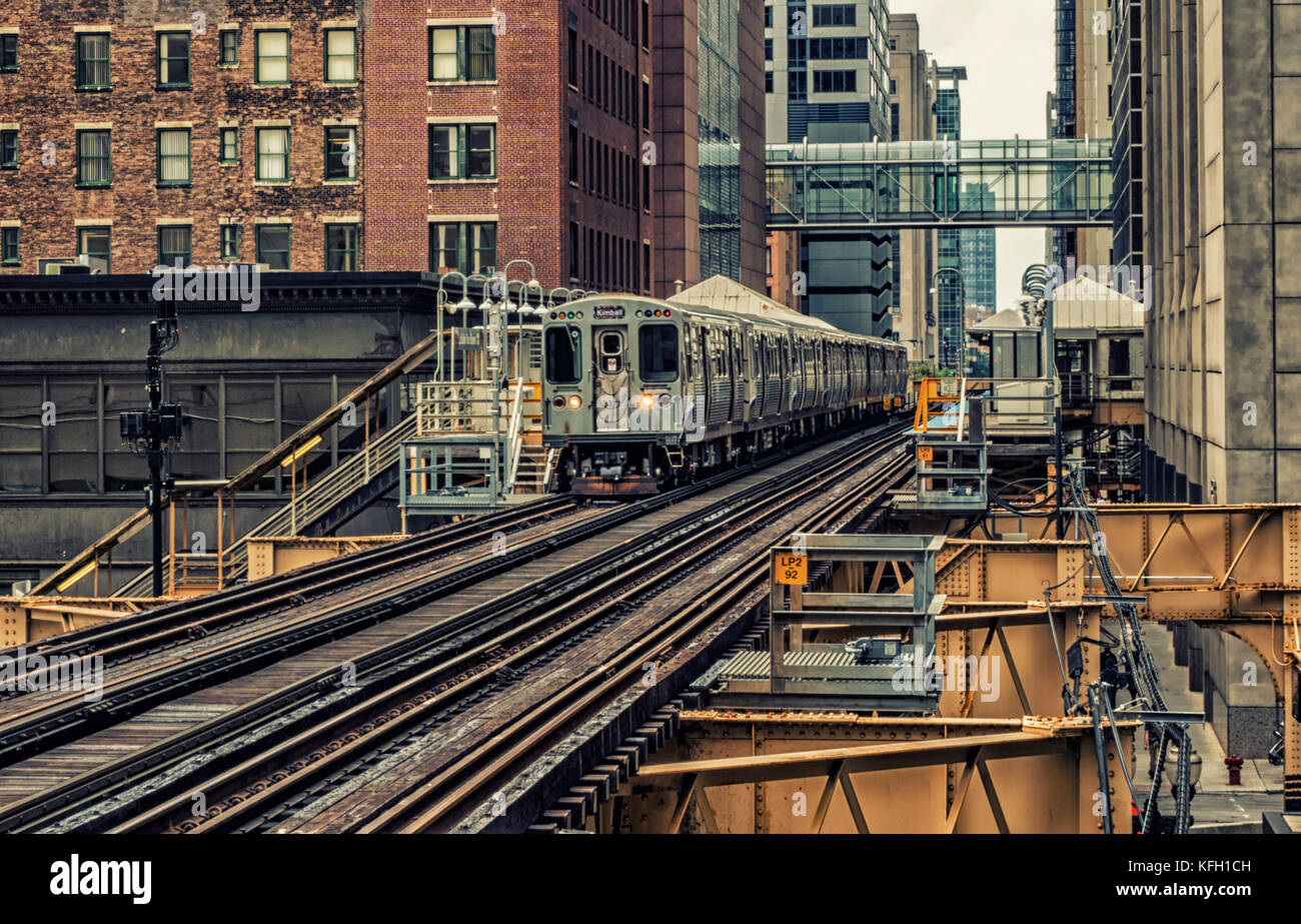 Train on elevated tracks within buildings at the Loop, Glass and Steel ...