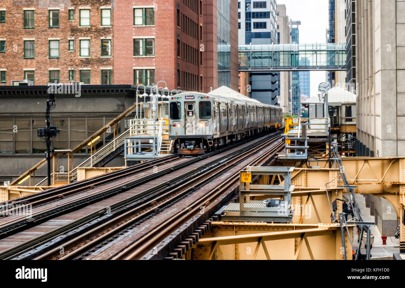 Train on elevated tracks within buildings at the Loop, Glass and Steel ...