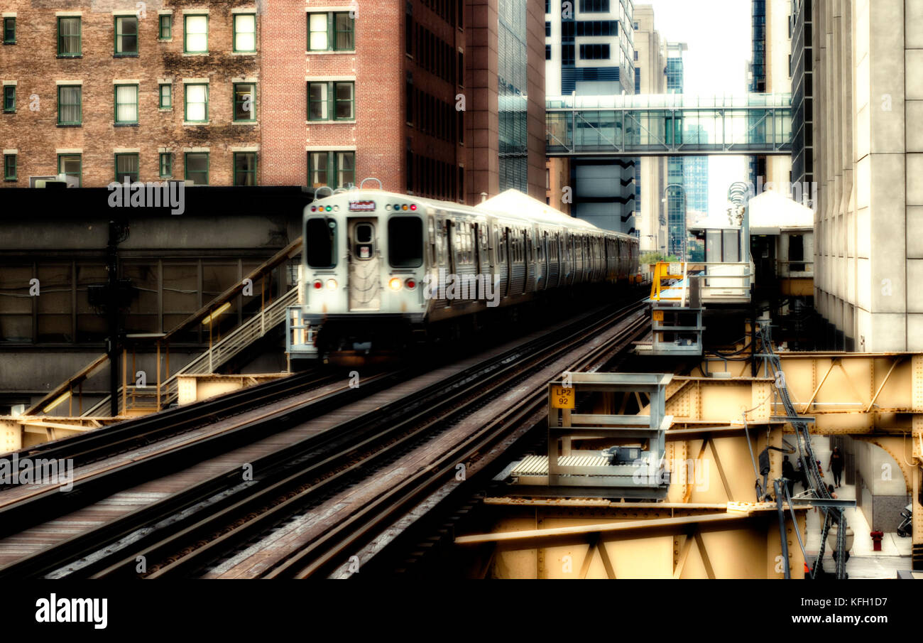Train on elevated tracks within buildings at the Loop, Glass and Steel ...