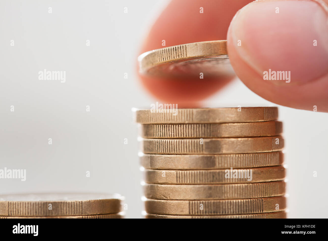 Cropped image of businessman hand stacking coins in office Stock Photo ...