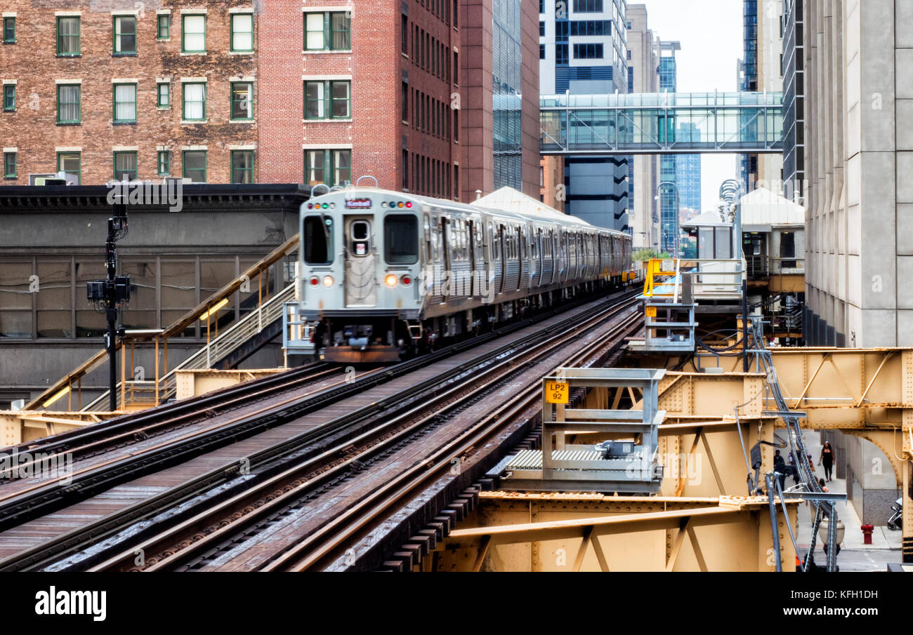 Train on elevated tracks within buildings at the Loop, Glass and Steel ...