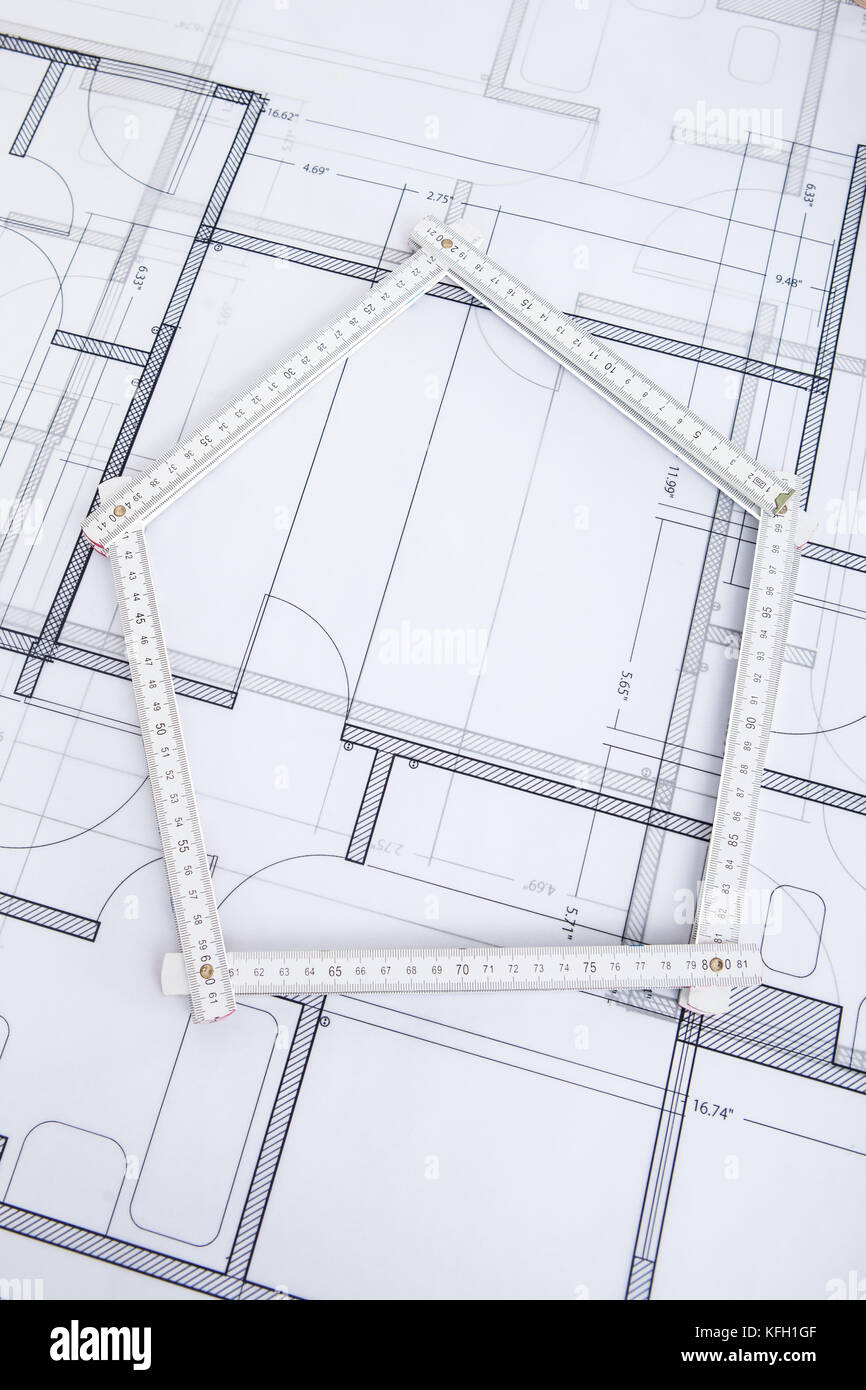 Closeup of folding ruler in house shape on blueprint Stock Photo - Alamy