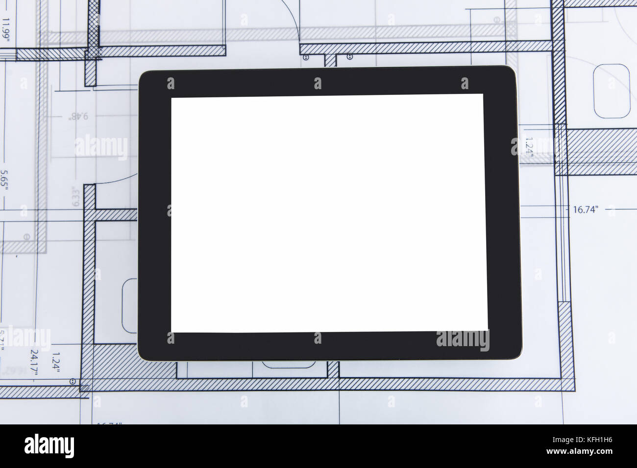 Closeup photo of digital tablet on blueprint Stock Photo - Alamy