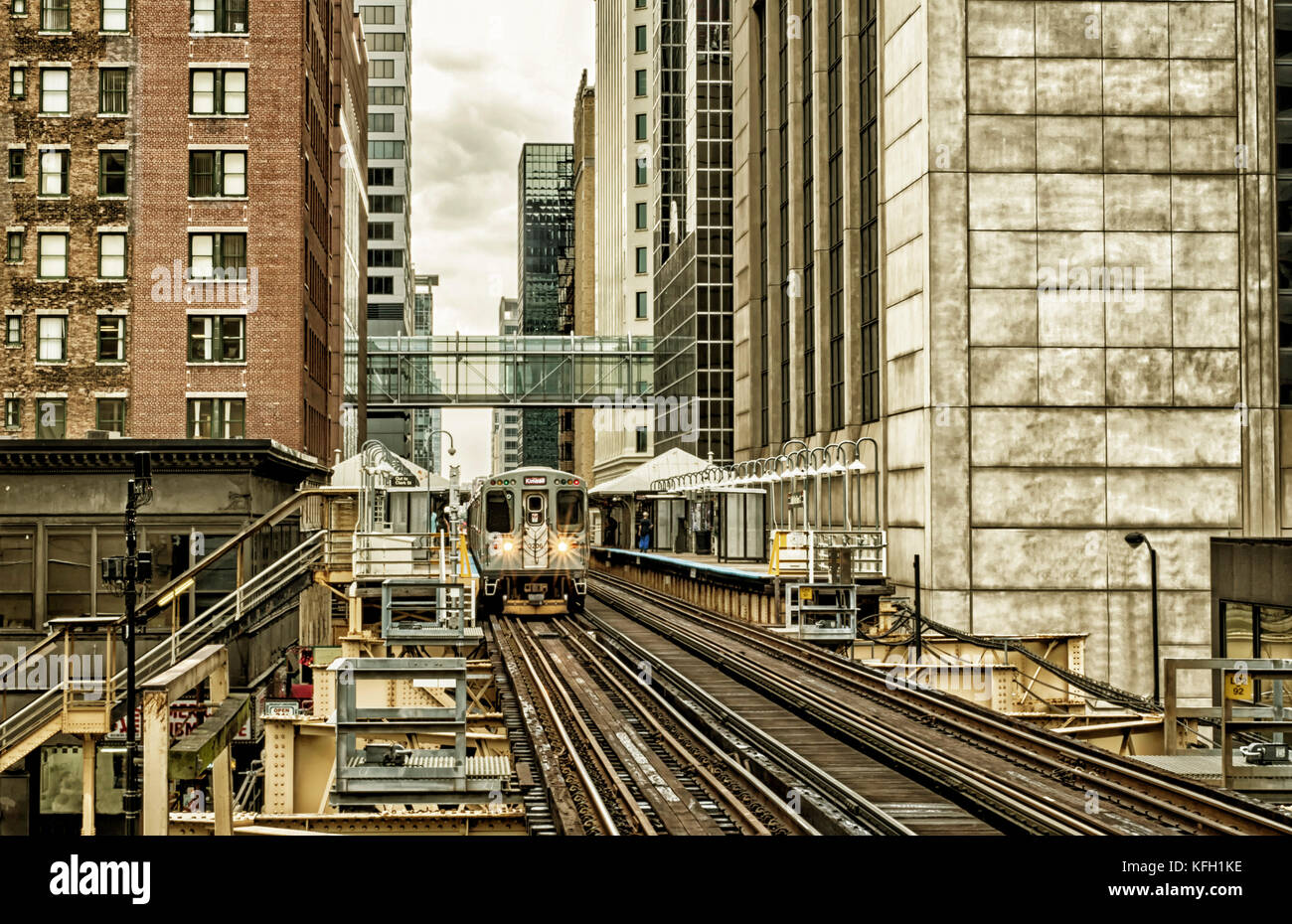 Train on elevated tracks within buildings at the Loop, Glass and Steel ...