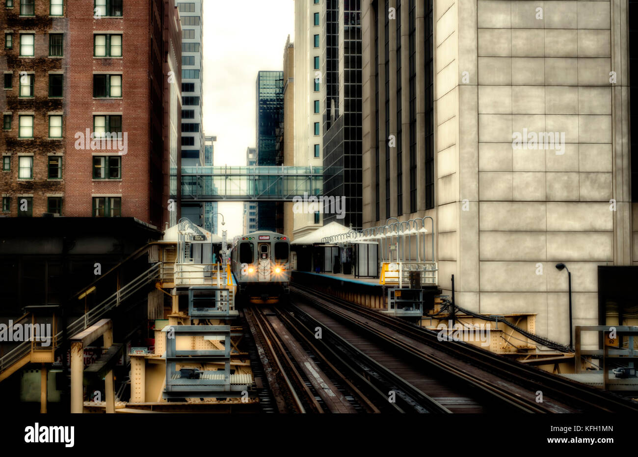 Train on elevated tracks within buildings at the Loop, Glass and Steel ...
