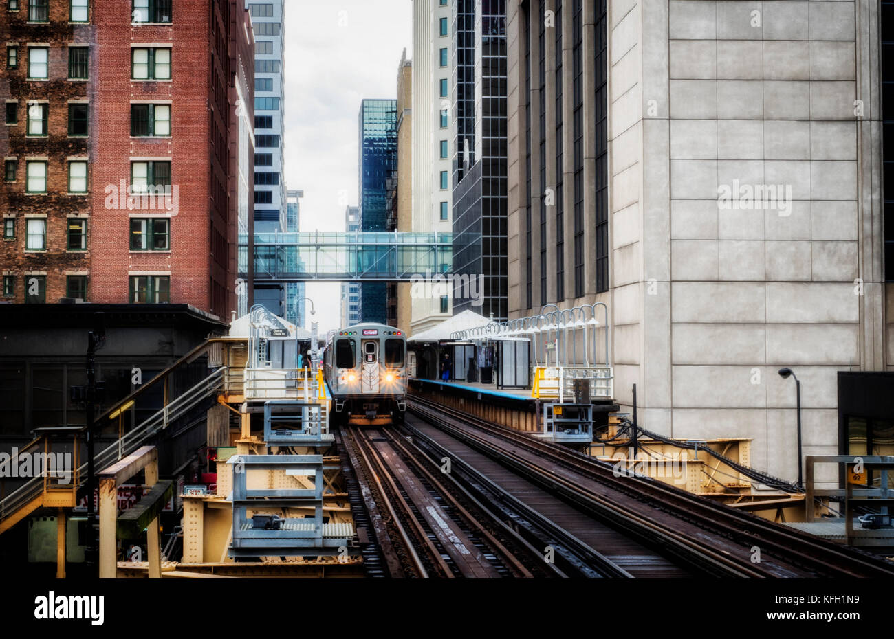 Train on elevated tracks within buildings at the Loop, Glass and Steel ...