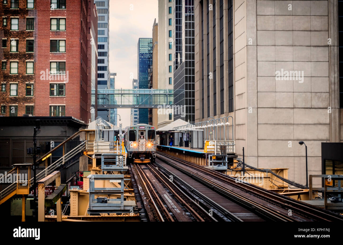 Train on elevated tracks within buildings at the Loop, Glass and Steel ...