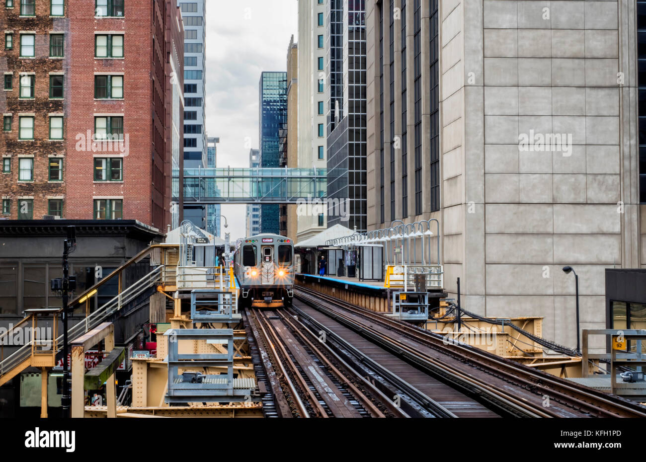 Train on elevated tracks within buildings at the Loop, Glass and Steel ...