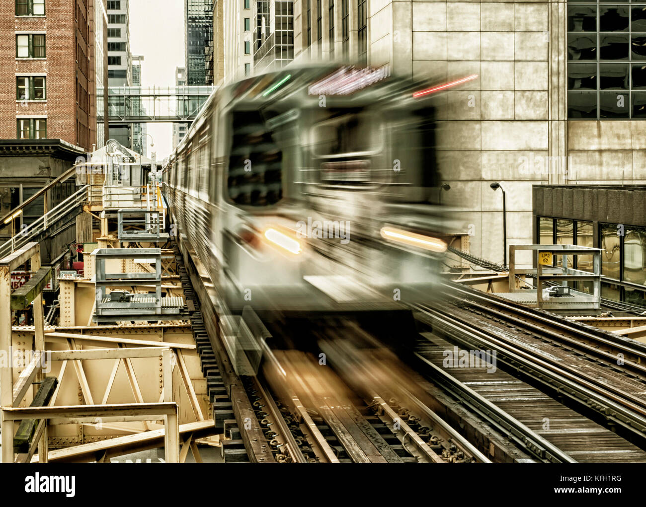 Moving Train on elevated tracks within buildings at the Loop, Glass and ...