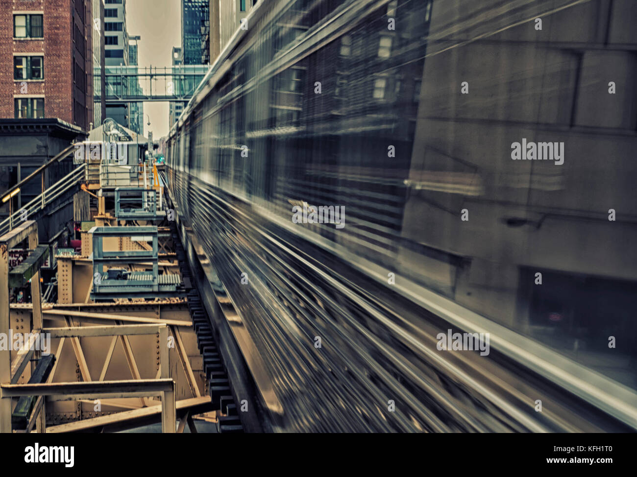 Moving Train on elevated tracks within buildings at the Loop, Glass and ...