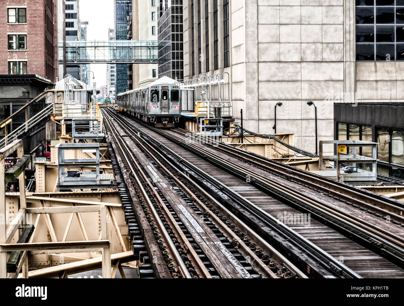 Train on elevated tracks within buildings at the Loop, Glass and Steel ...