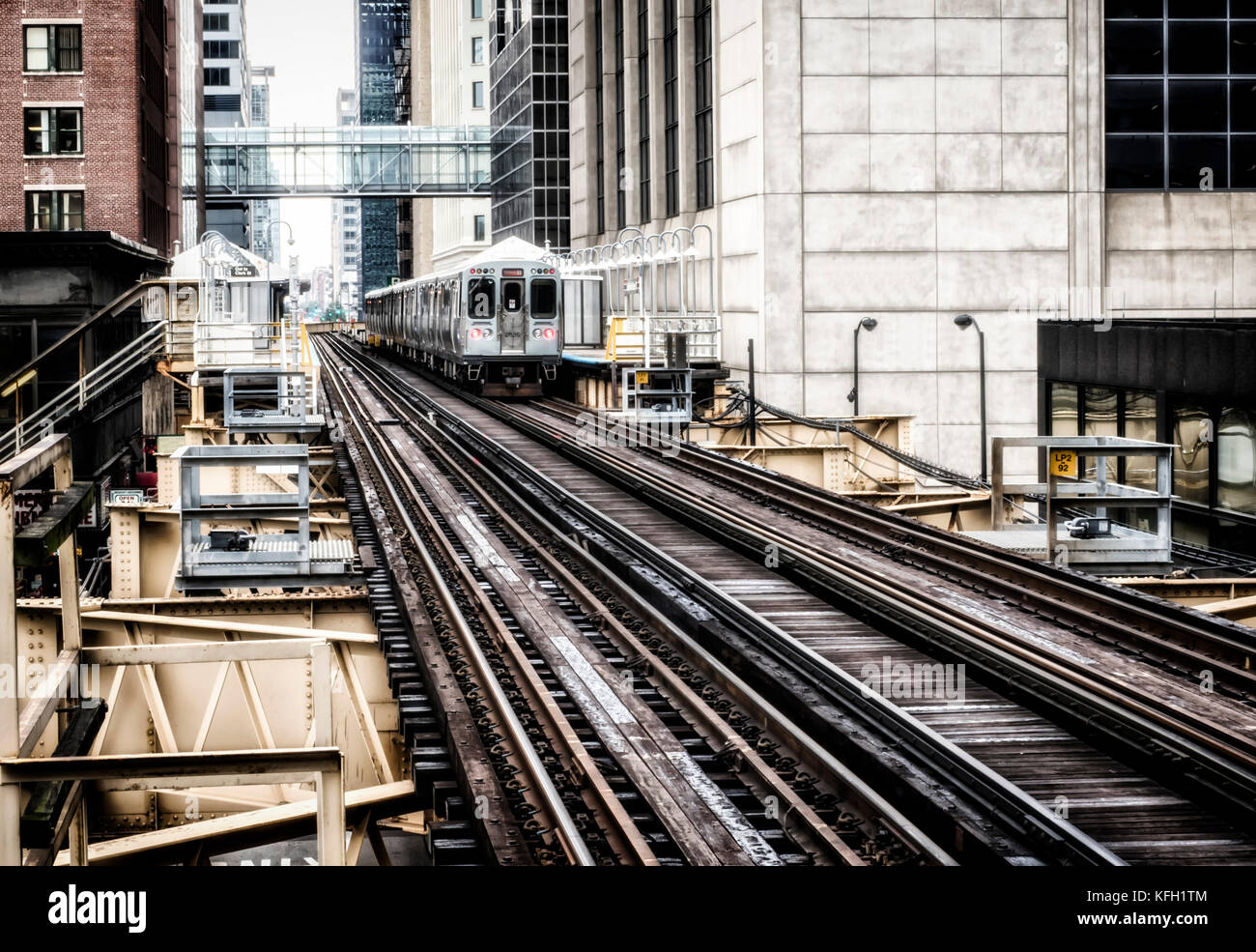 Train on elevated tracks within buildings at the Loop, Glass and Steel ...