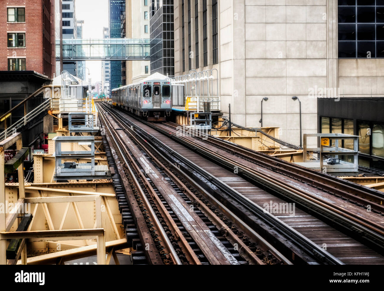 Train on elevated tracks within buildings at the Loop, Glass and Steel ...