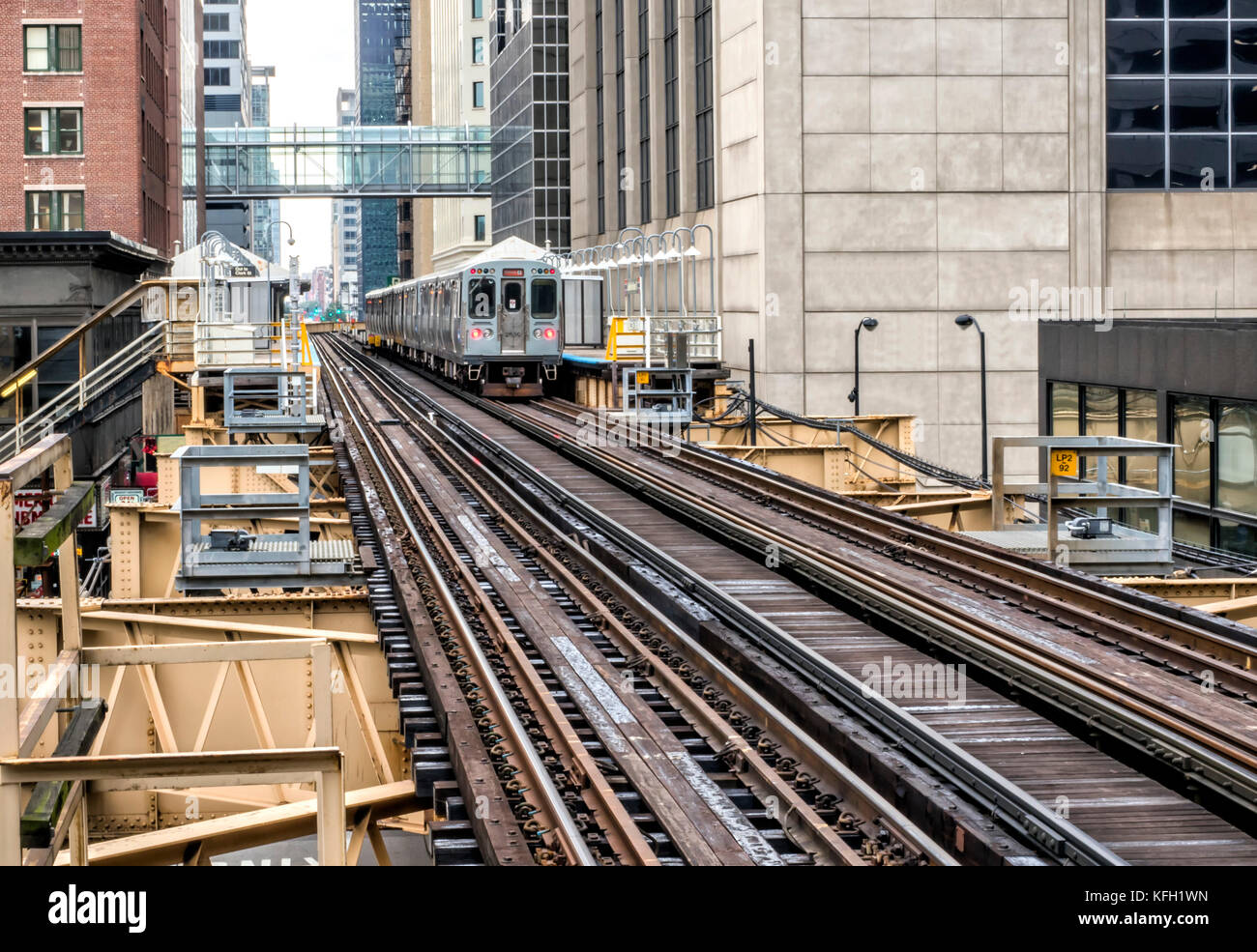 Train on elevated tracks within buildings at the Loop, Glass and Steel ...