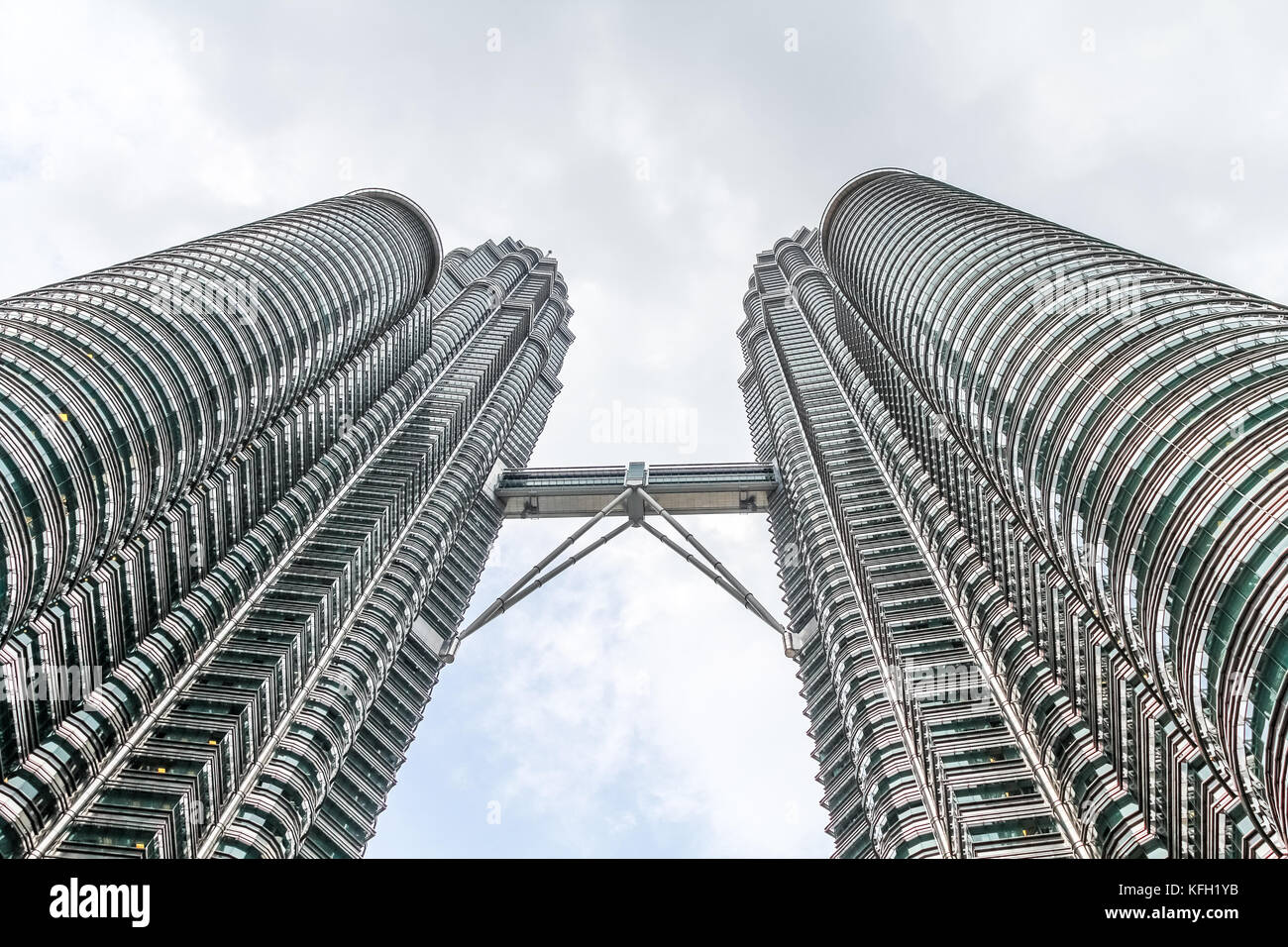 Daylight view to the top of petronas twin towers and bridge, downtown ...