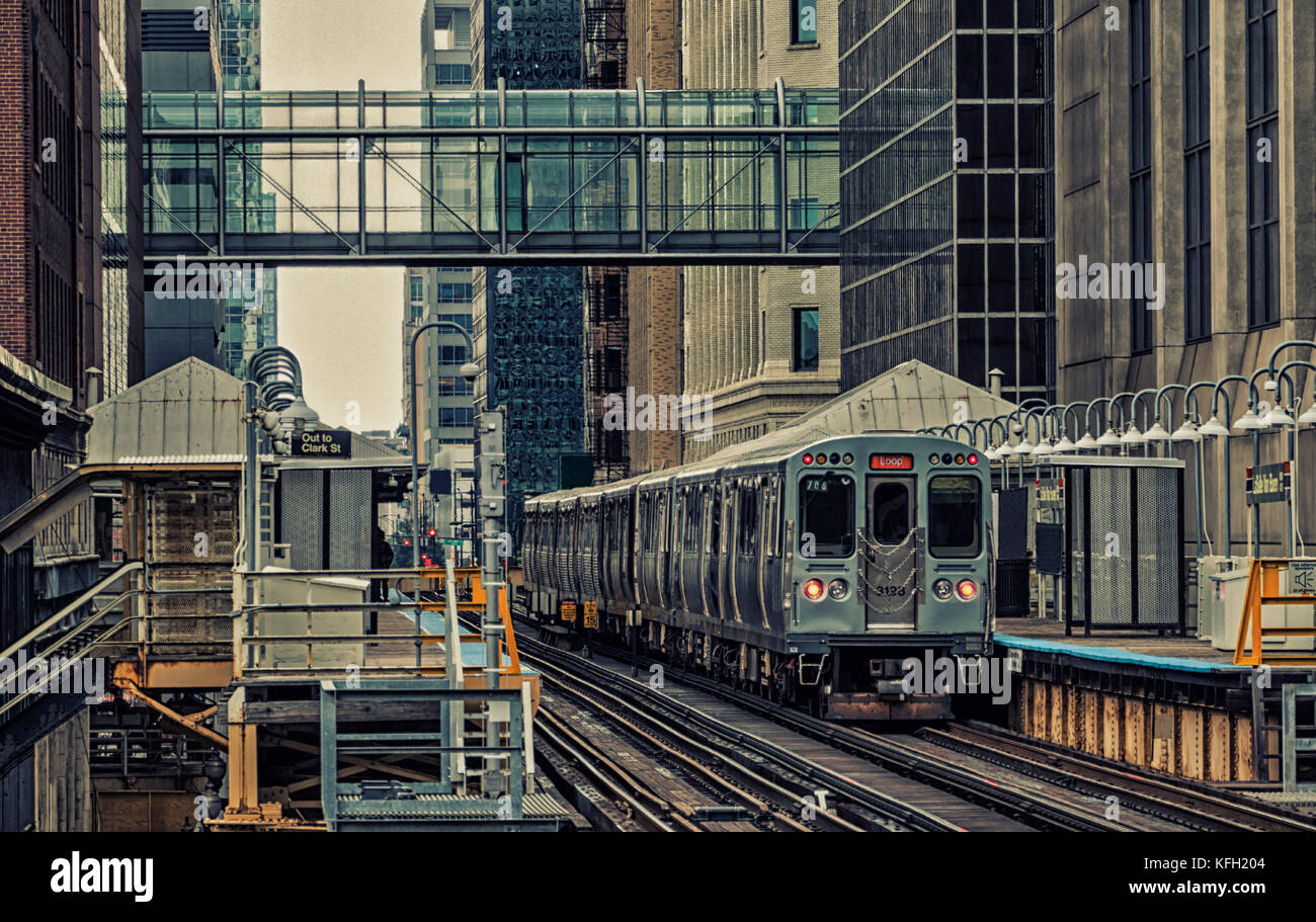 Train on elevated tracks within buildings at the Loop, Glass and Steel ...