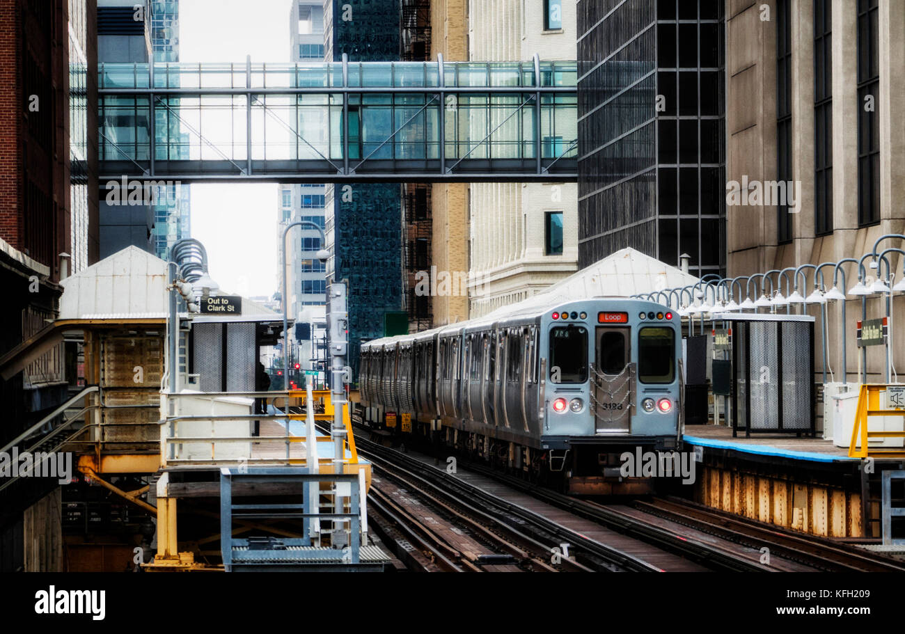 Train on elevated tracks within buildings at the Loop, Glass and Steel ...