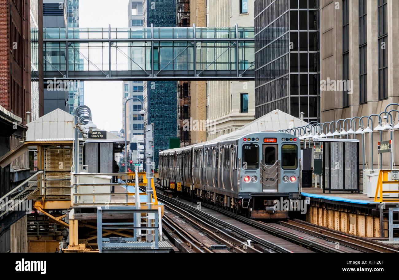 Train on elevated tracks within buildings at the Loop, Glass and Steel ...