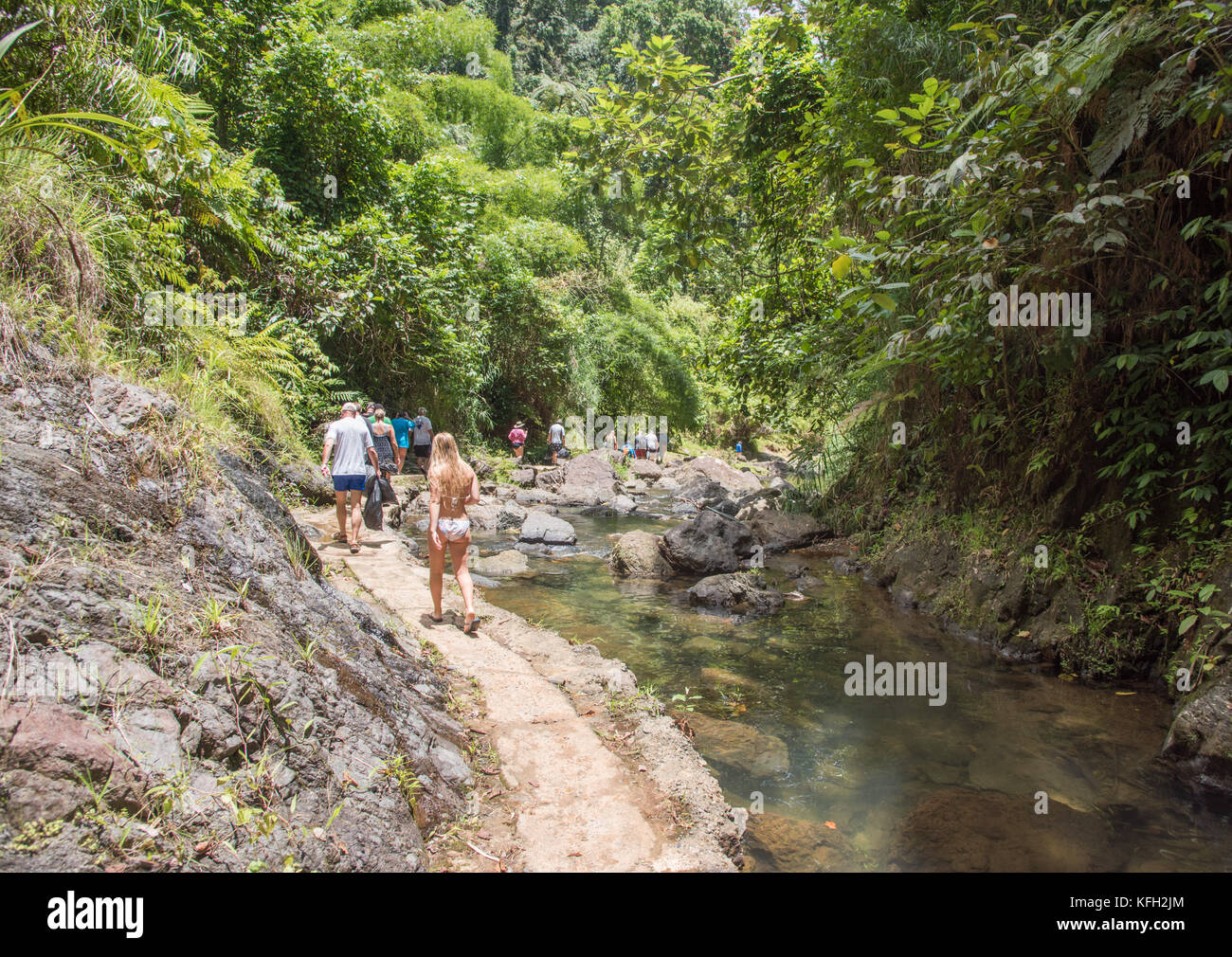 Group of people hiking through rocky landscape hi-res stock photography ...