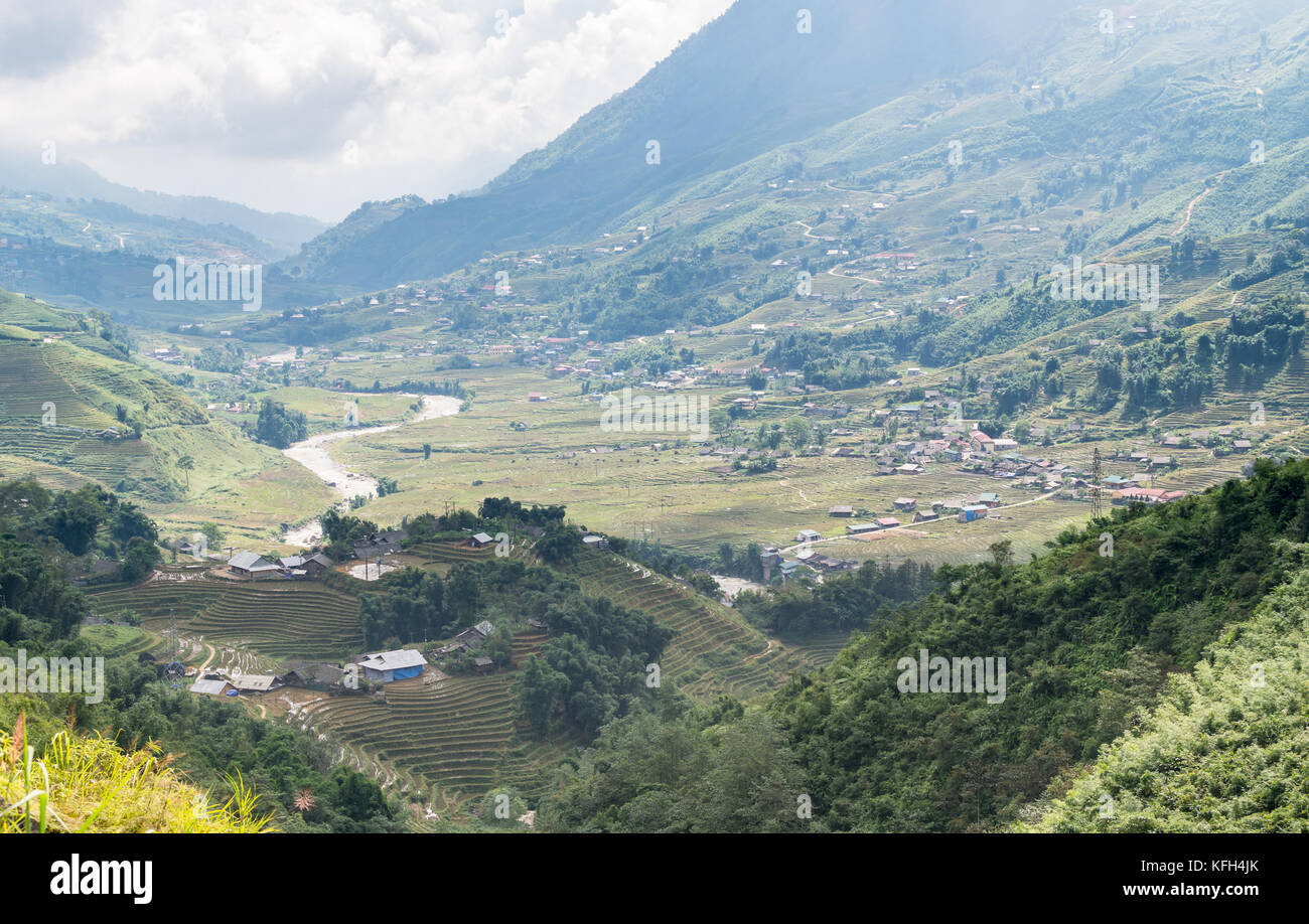 landscape view of village in valley near the mountains and rice ...