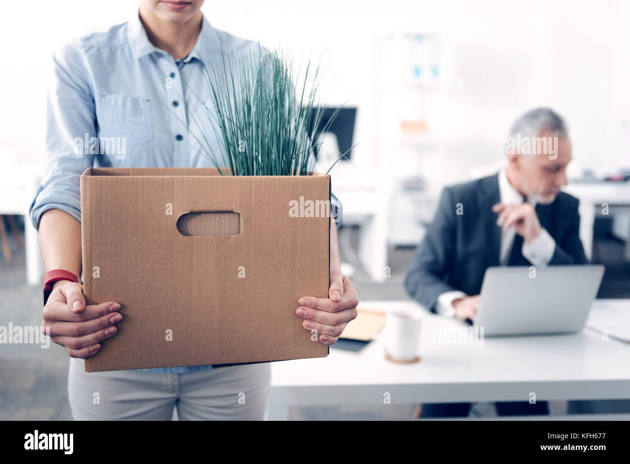 Office worker holding box hi-res stock photography and images - Alamy