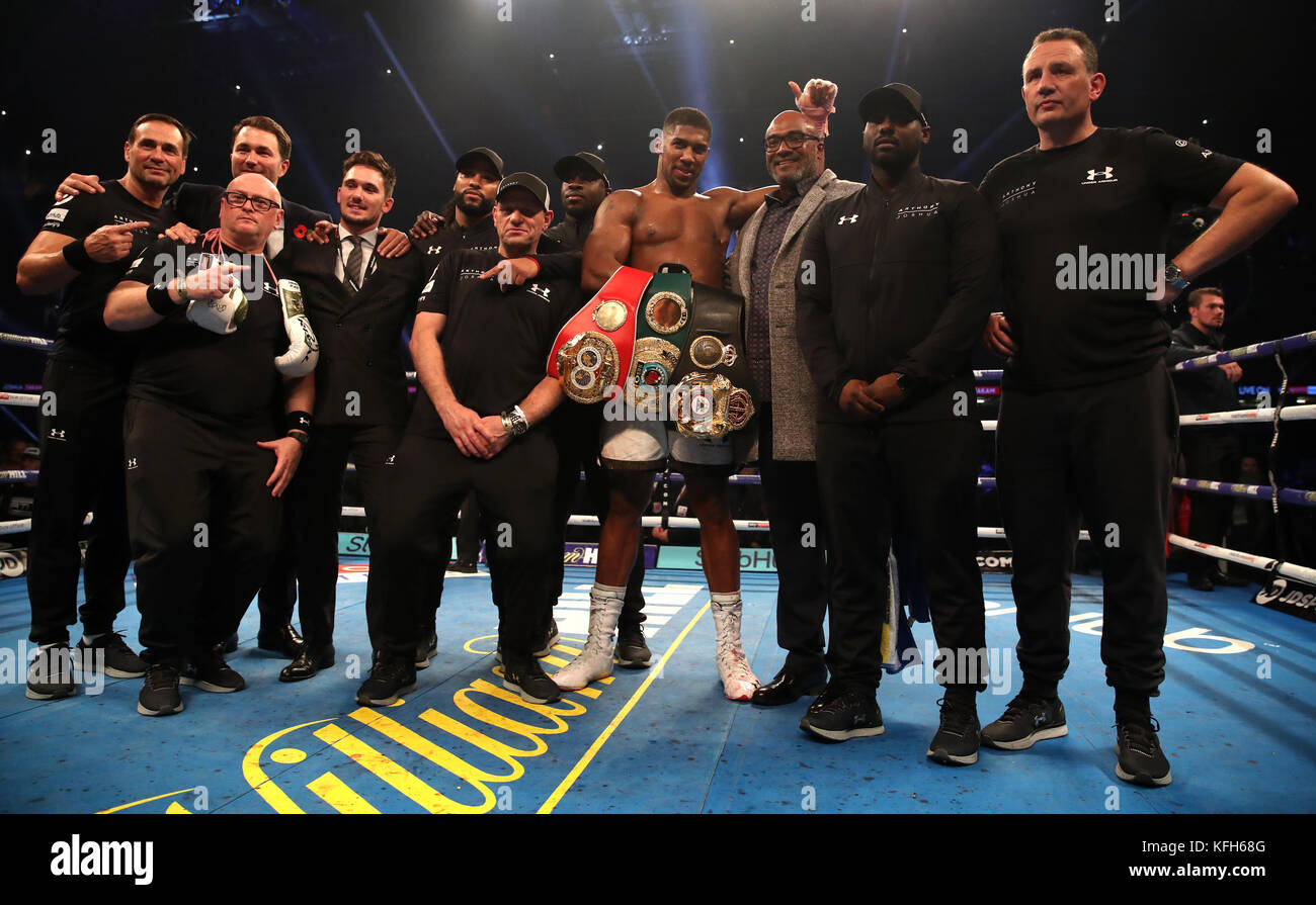 Anthony Joshua celebrates with his father, Robert, and his team, after ...