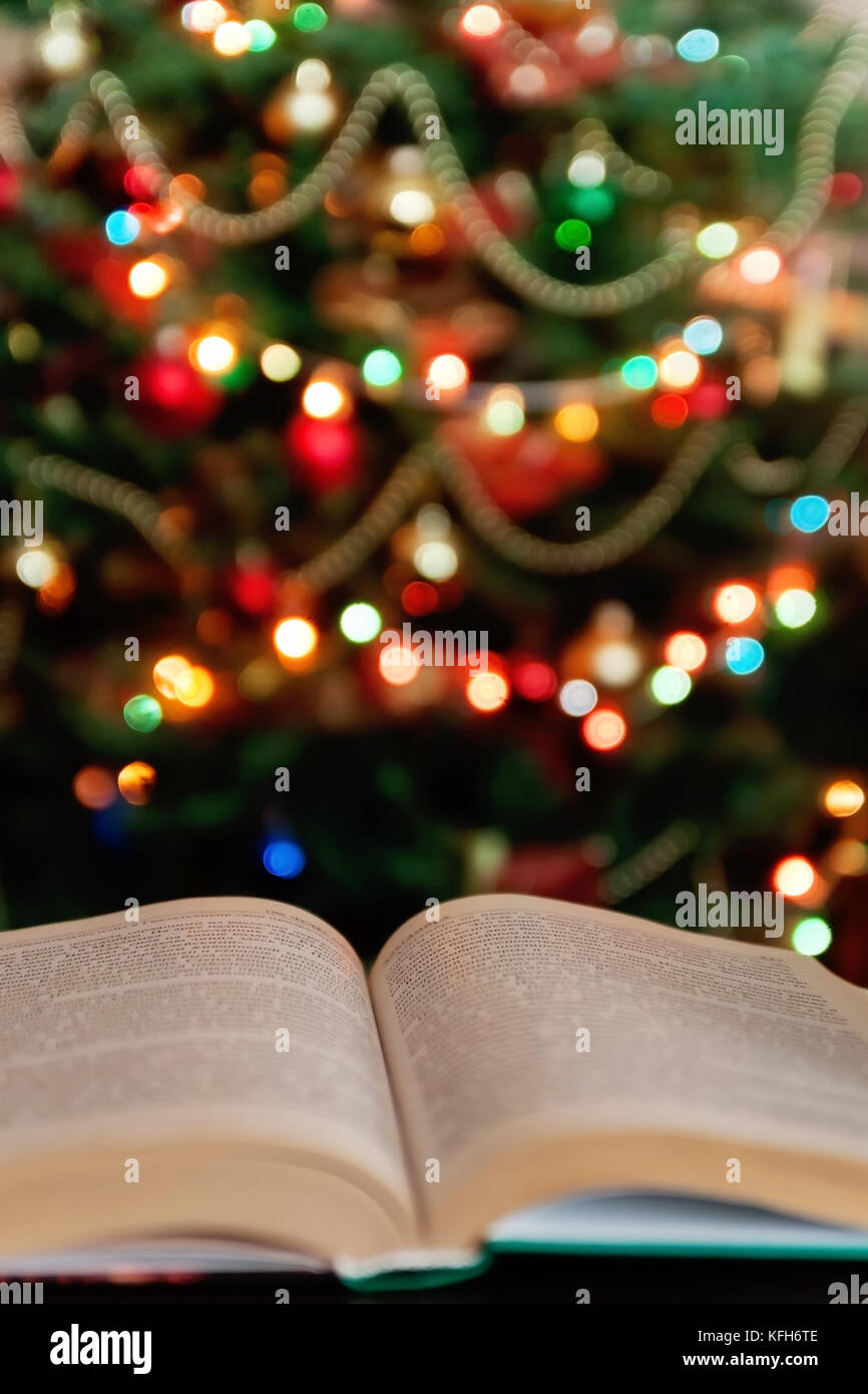 Christmas and bible with blurred candles light background Stock Photo ...