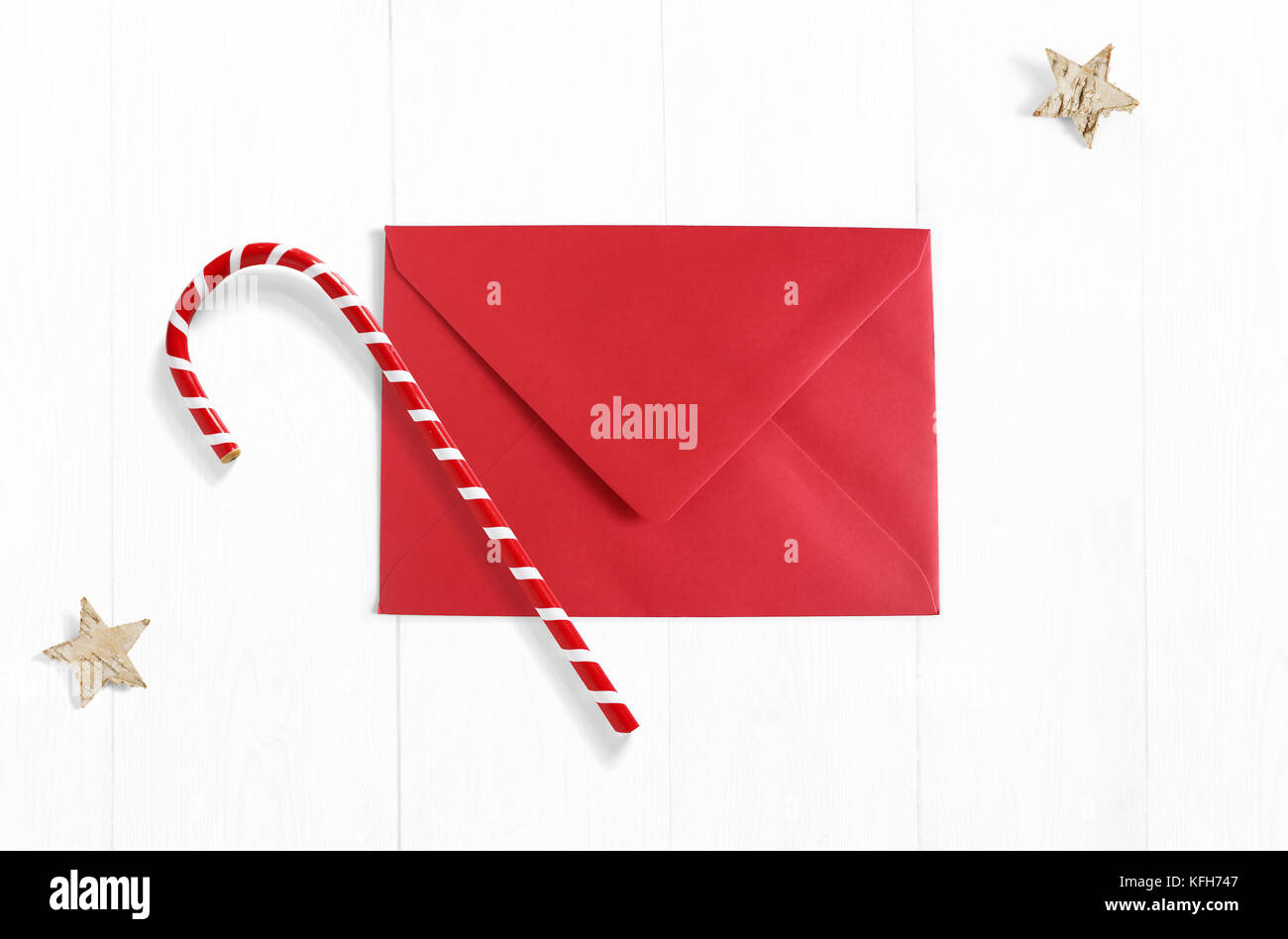 Christmas mockup scene with red envelope, candy cane decoration and ...