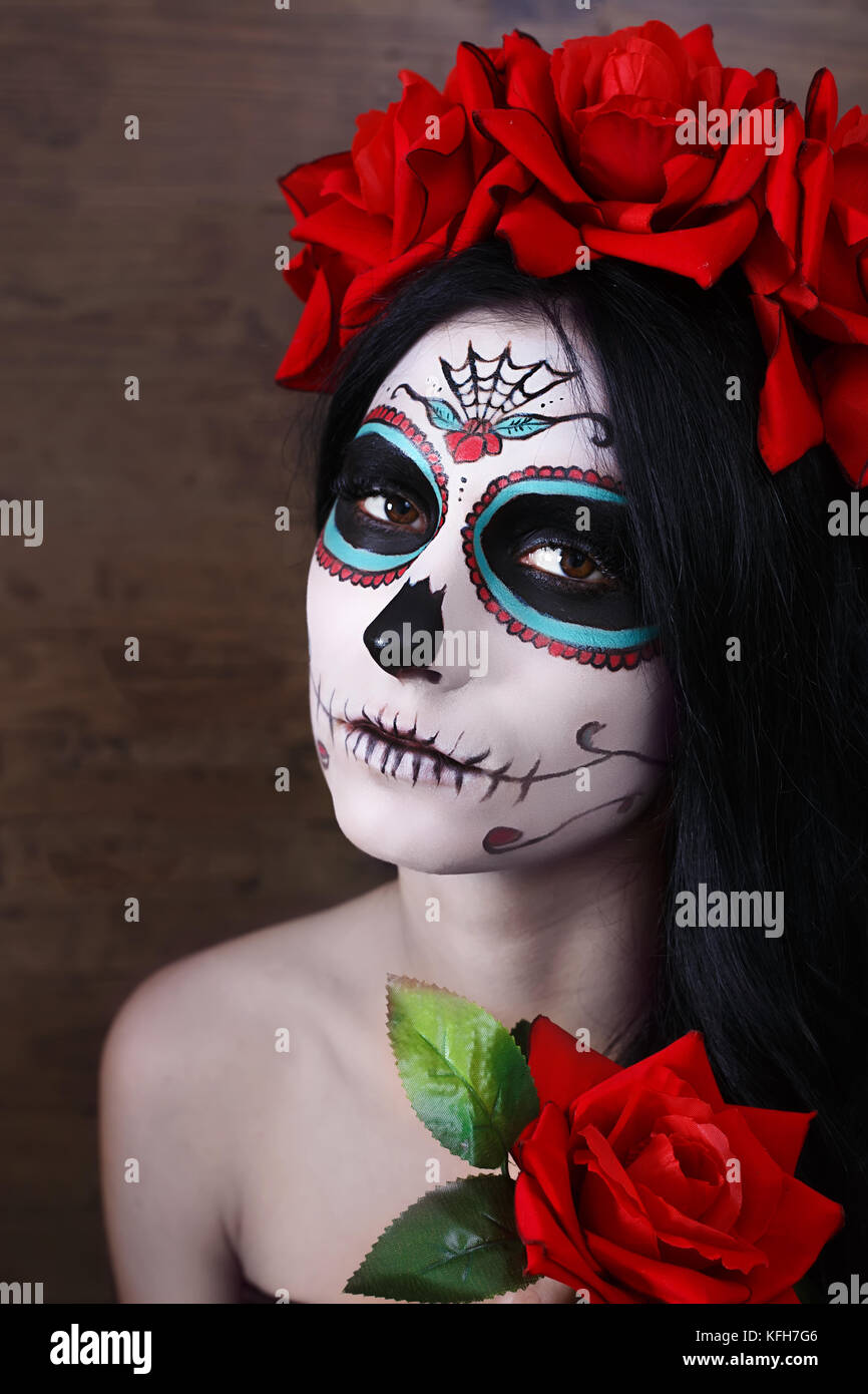 Day of the dead. Halloween. Young woman in day of the dead mask skull ...