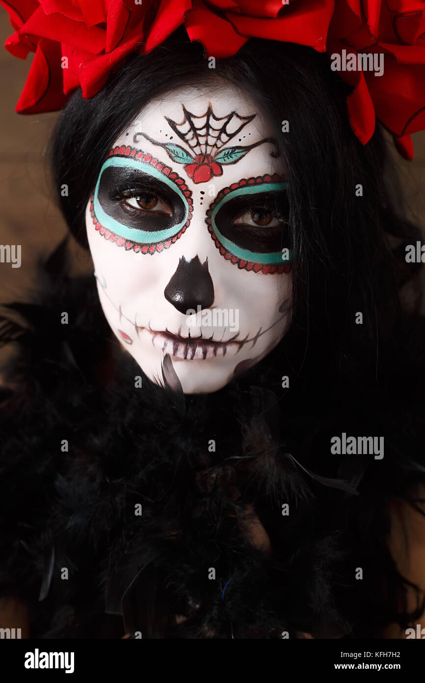 Day of the dead. Halloween. Young woman in day of the dead mask skull ...