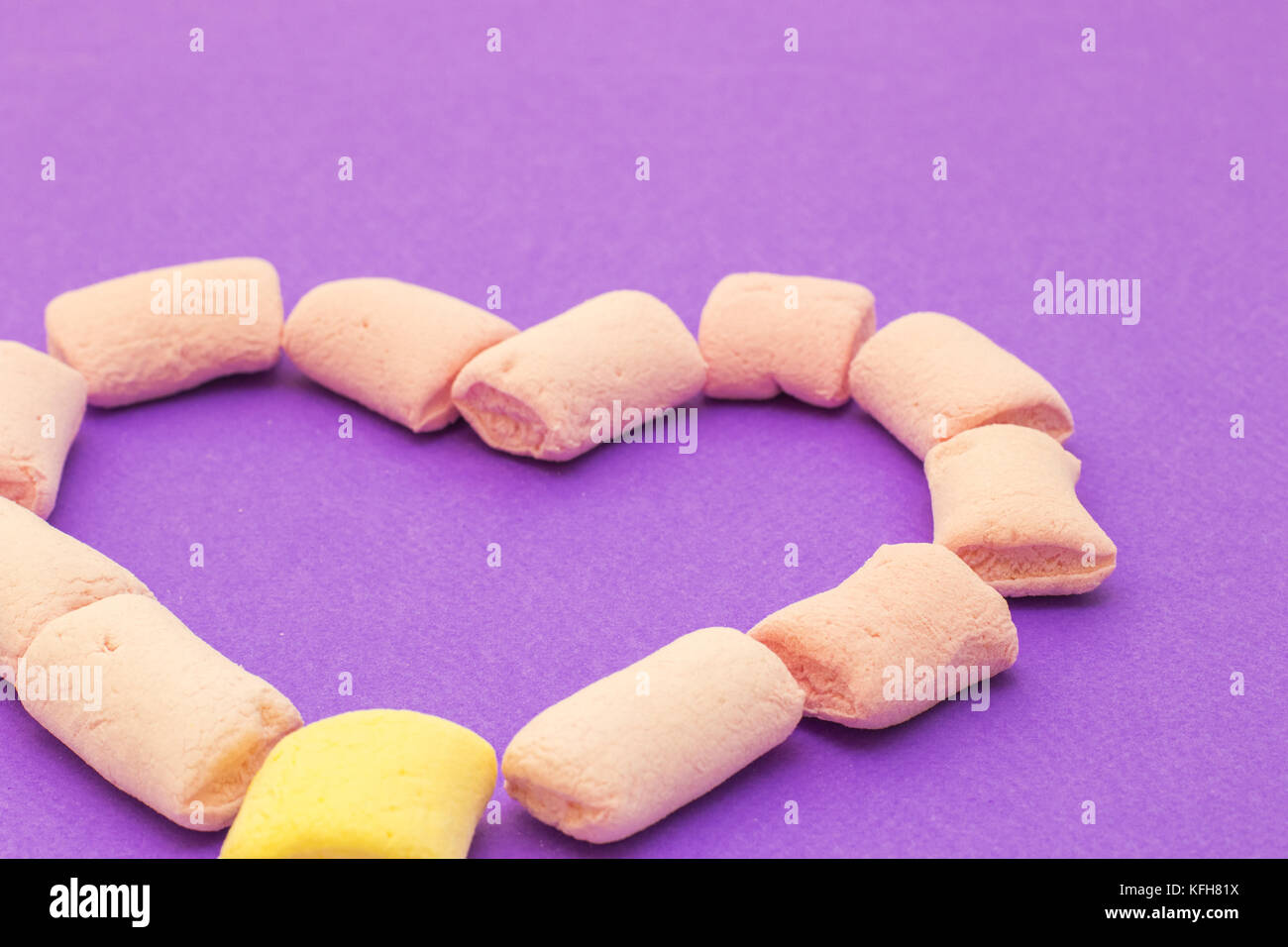 Love heart with pink and yellow marshmallows Stock Photo - Alamy