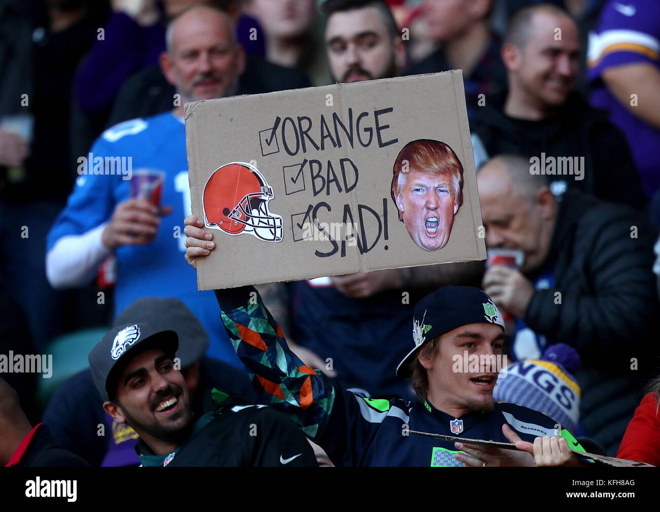 A fan holds up a sign that reads 'Orange, Bad, Sad' in the stands ...