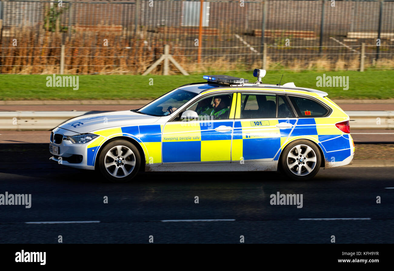 A Police Scotland BMW Police car with blue lights flashing speeding ...